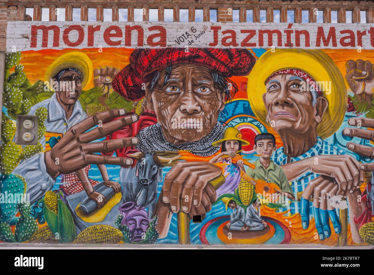 A street scene with a colorful mural in Mitla, a small town in the ...