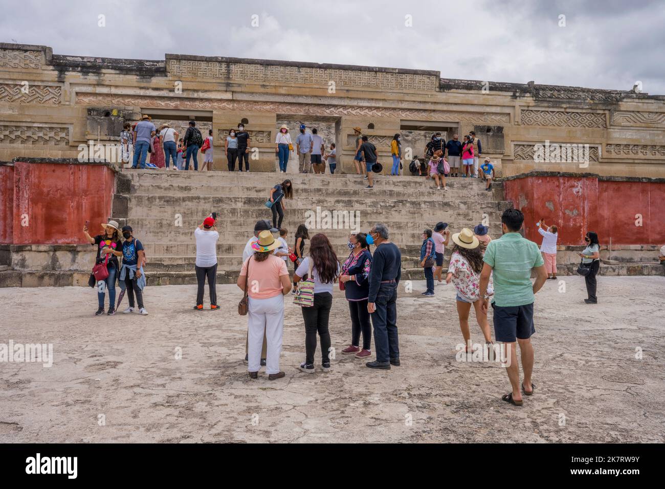 Tourists visiting the ruins of Zapotec buildings at the Mitla ...