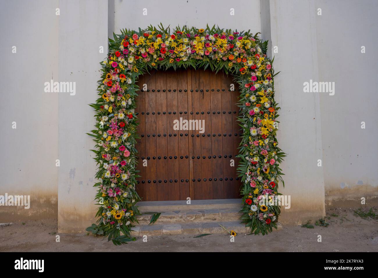 Flower decorations from a wedding on a door of the ancient roofless ...