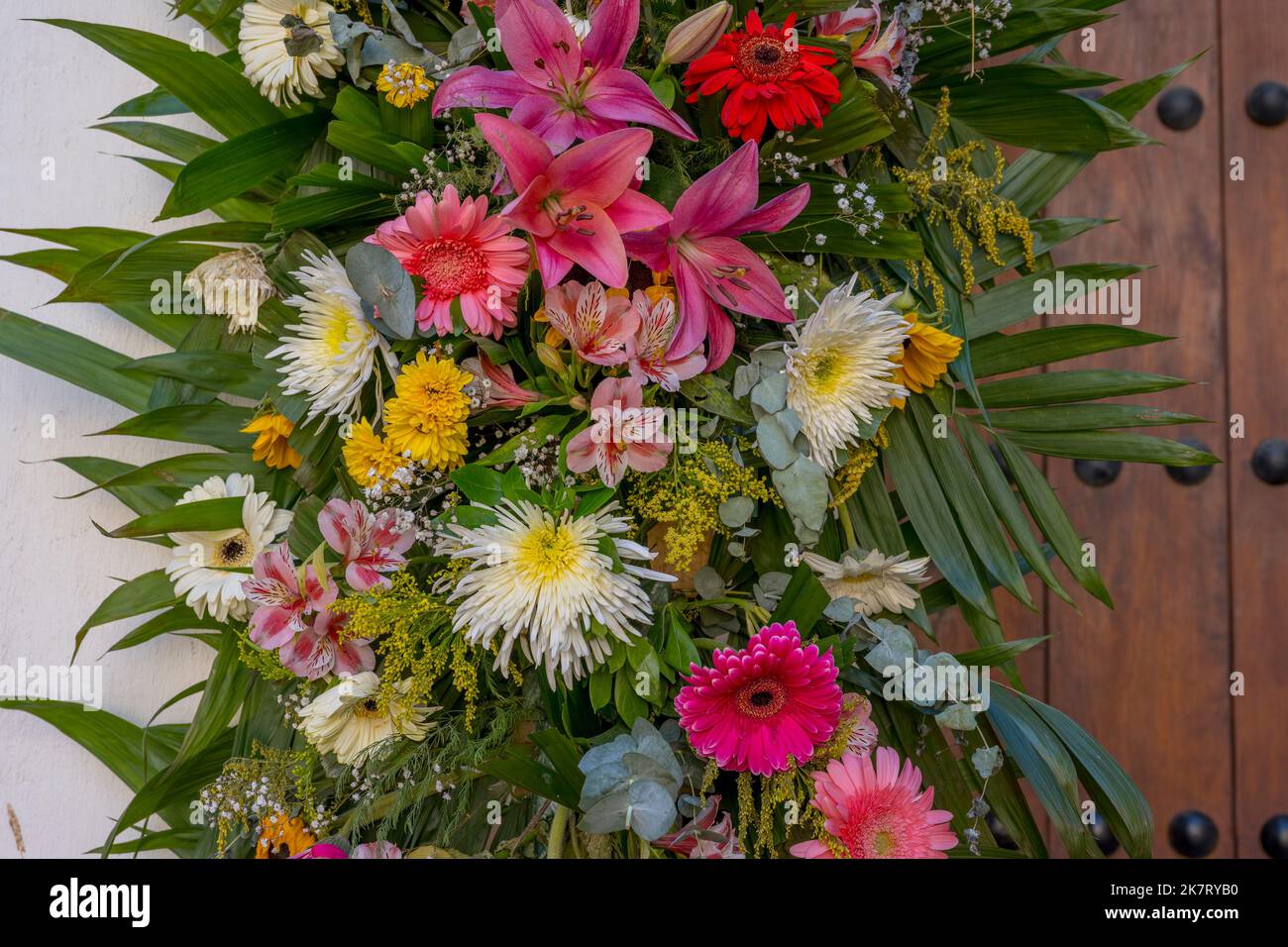 Flower decorations from a wedding on a door of the ancient roofless ...