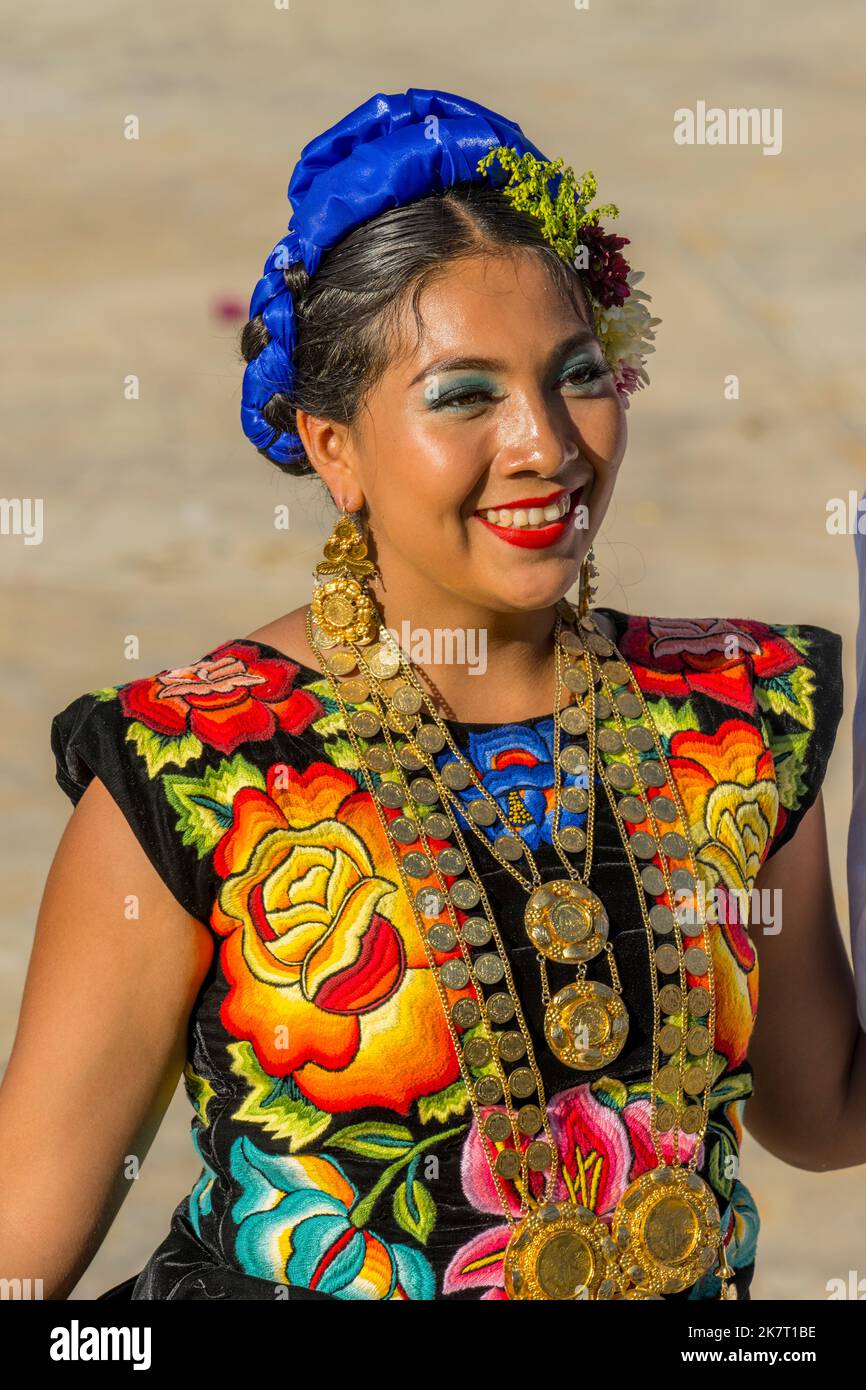 Close-up of a woman performing a traditional dance in the Guelaguetza ...