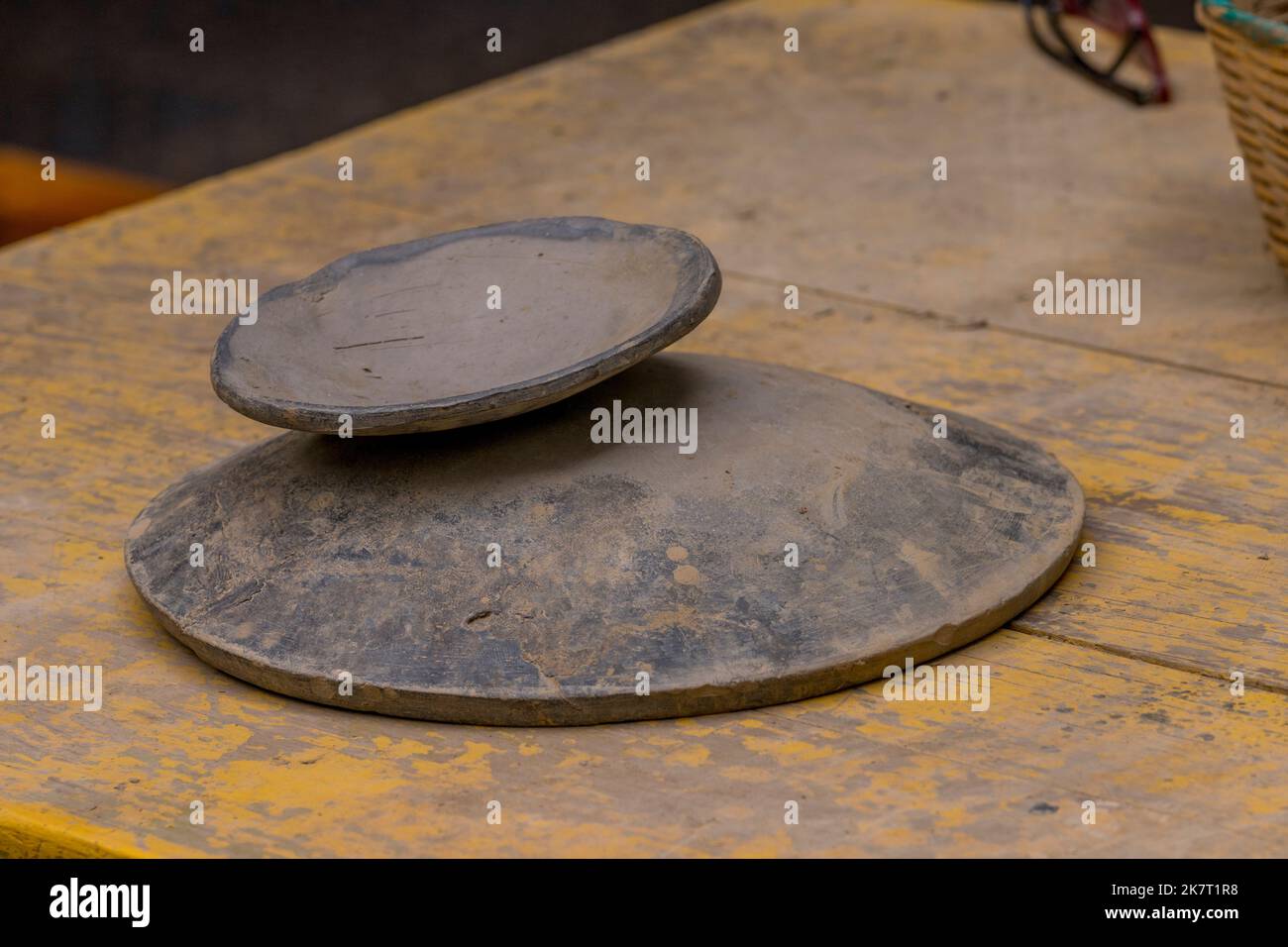 Two discs used as a pottery wheel in a pottery studio making Barro ...