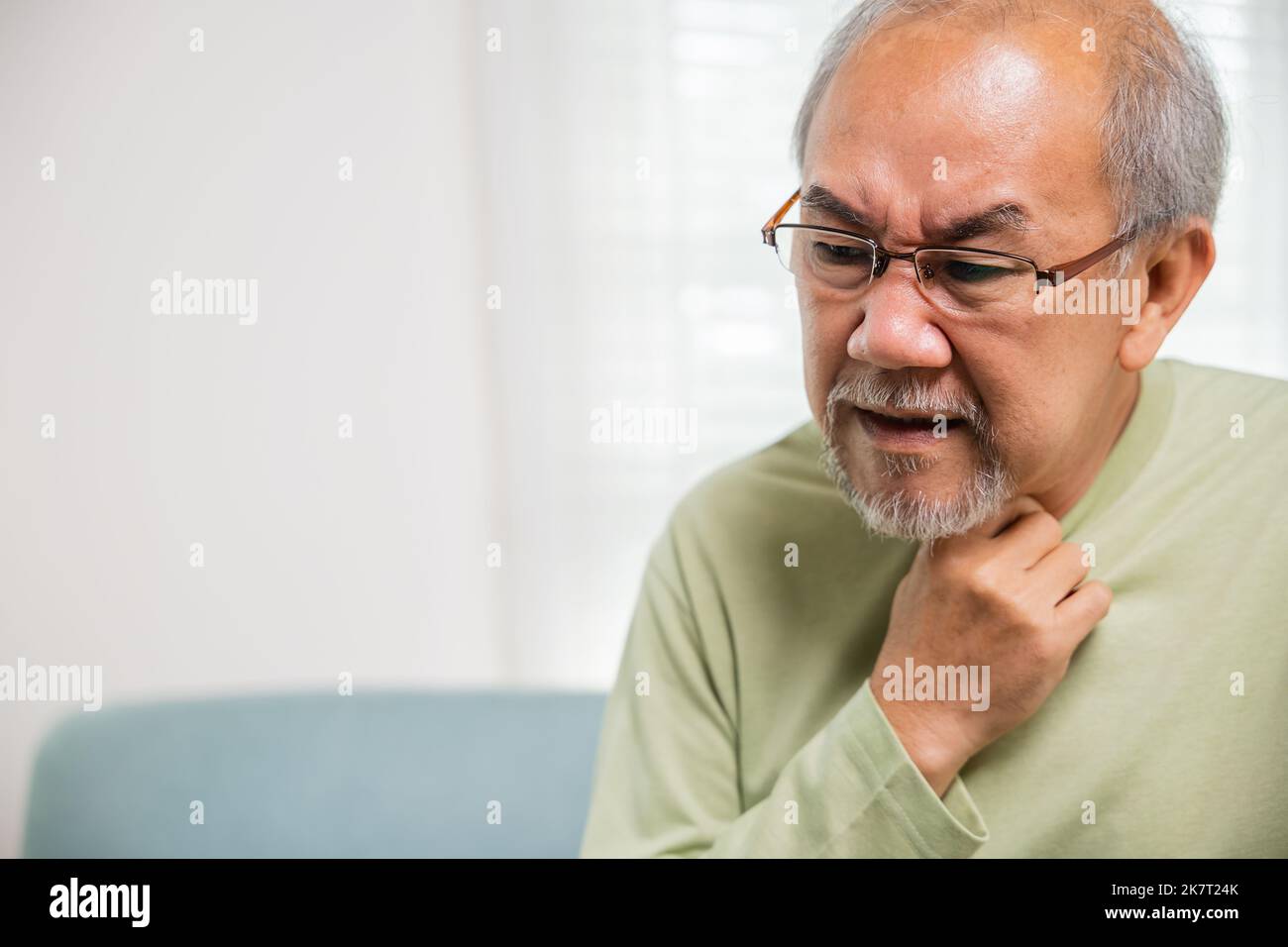 Retirement senior man feeling pain use hands holding neck and ...
