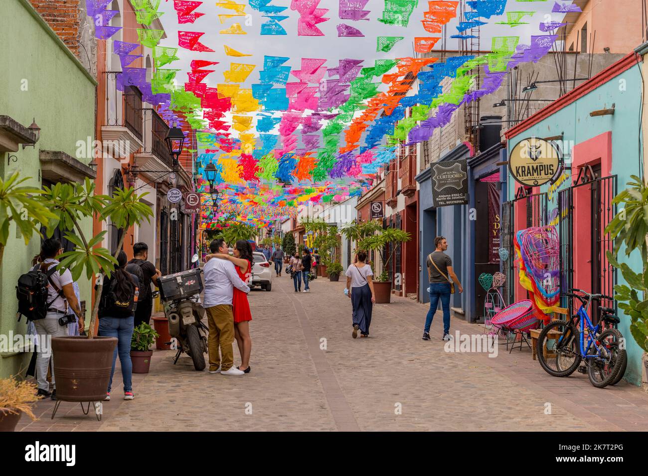 A street scene with Papel picado (traditional Mexican decorative craft ...