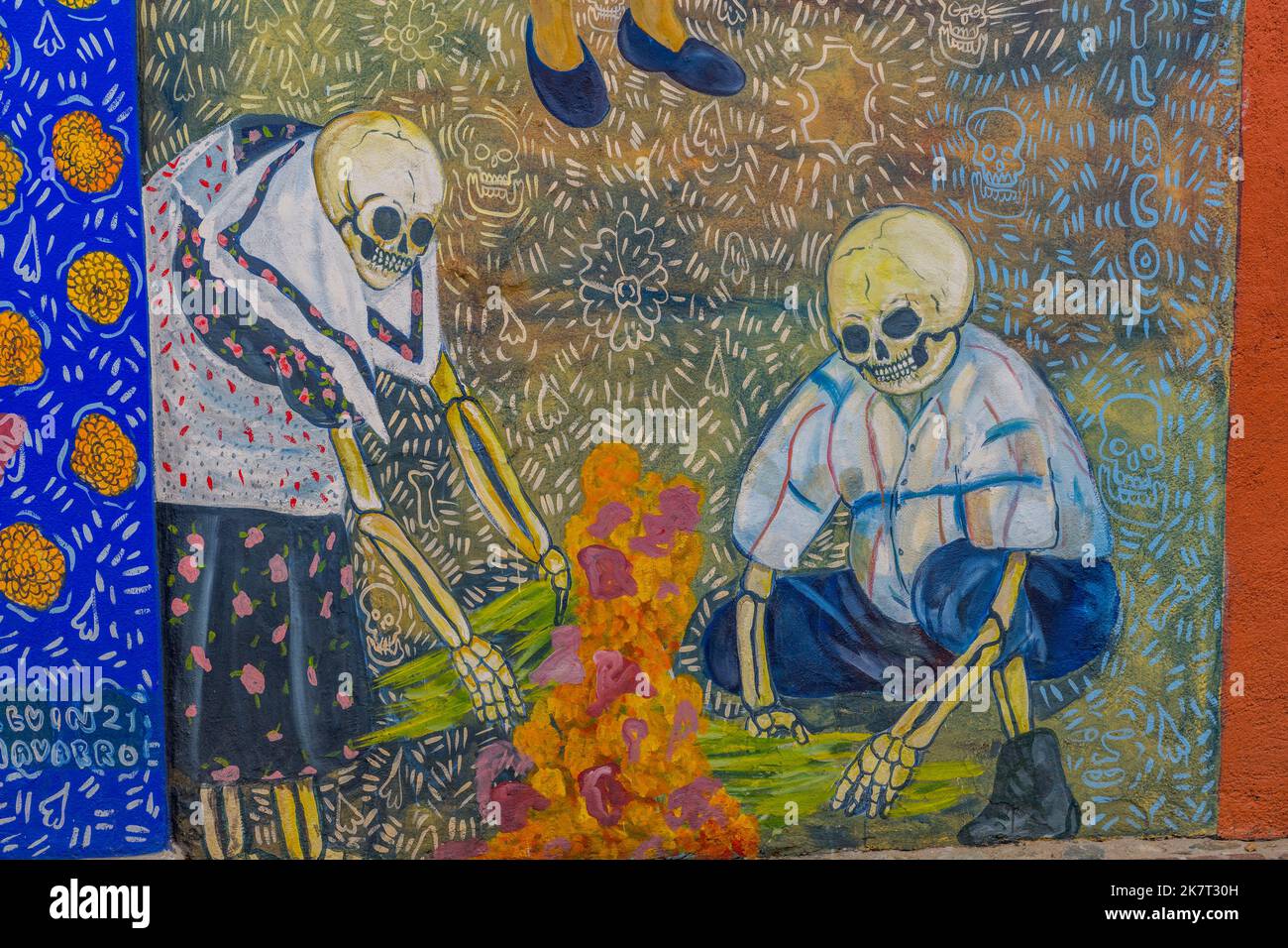 Many houses are painted with colorful murals, here with skeletons, in ...