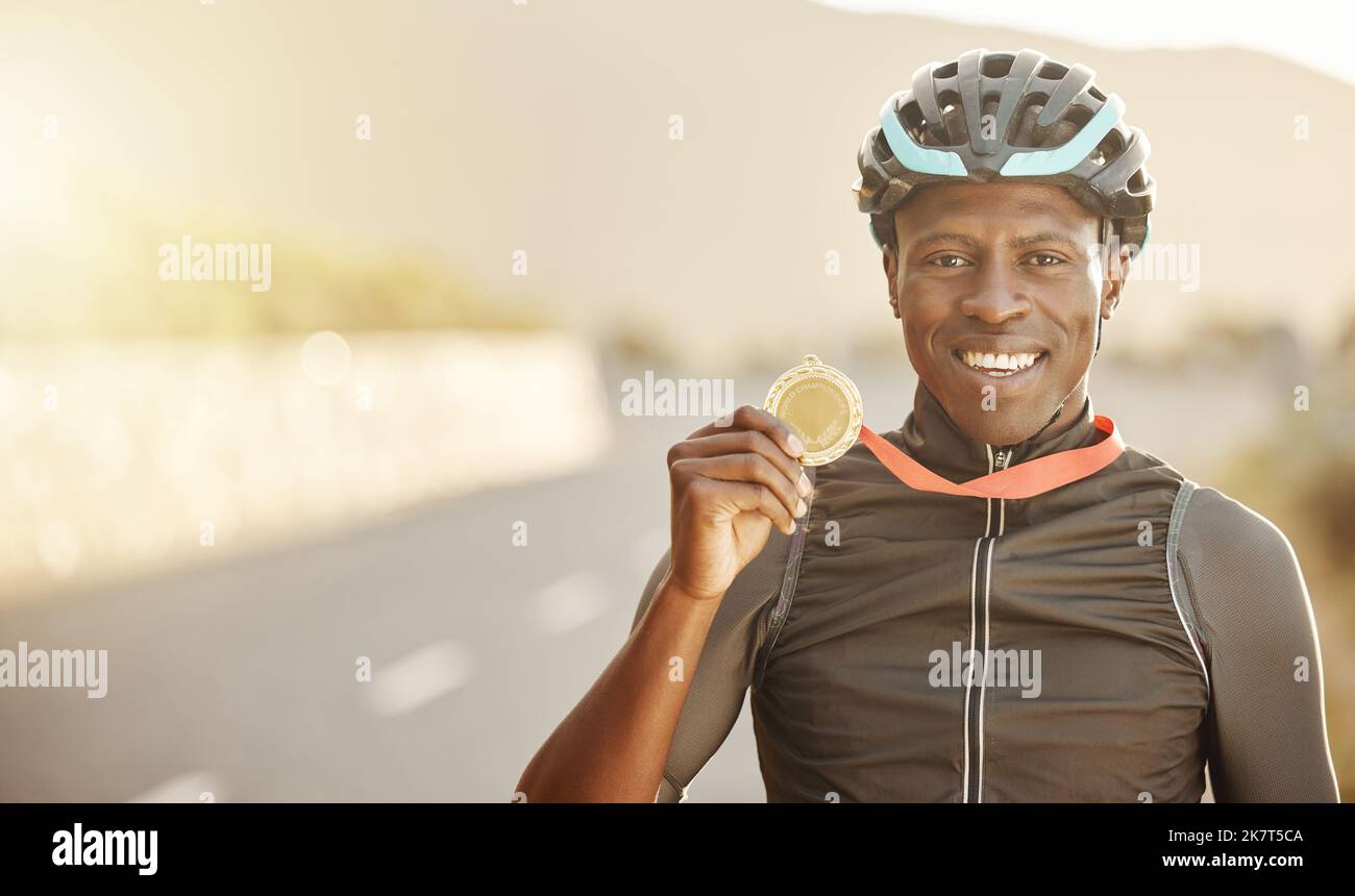 Cycling, marathon winner and gold medal by happy man holding, showing ...