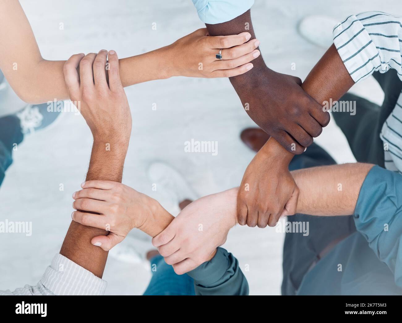 Wrist hands, team building and business people support diversity, group ...