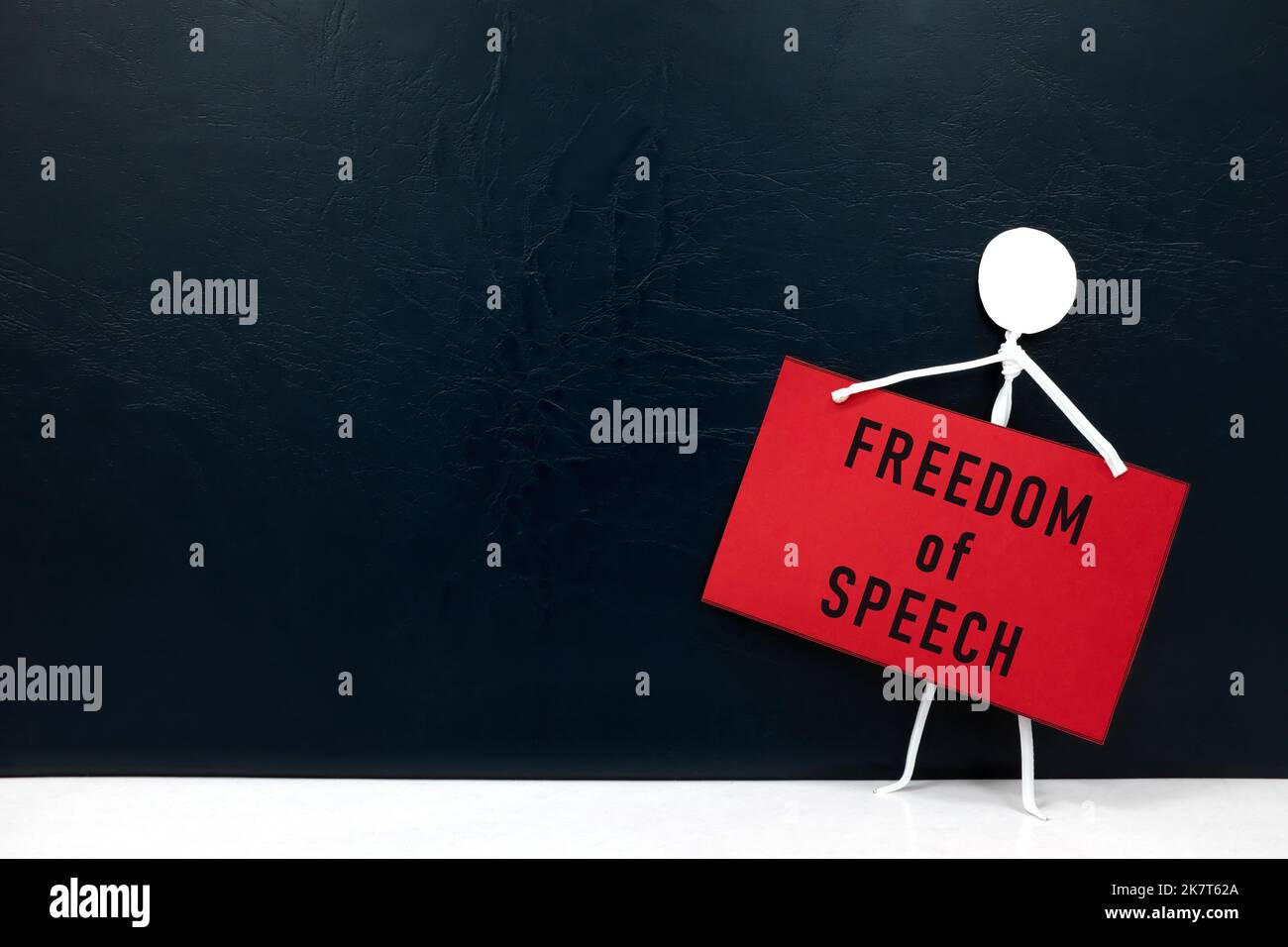 Freedom of speech concept. Human stick figure holding a red placard on ...
