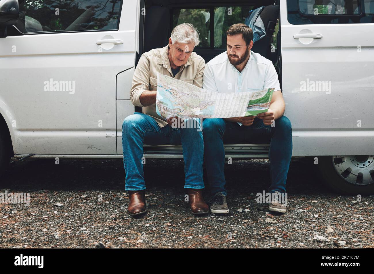 Senior man, father and son with map on travel adventure looking for ...