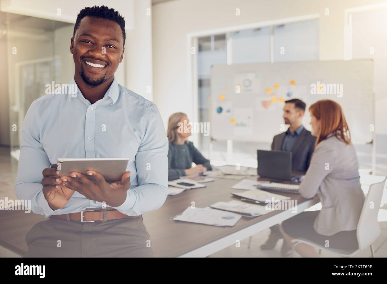 Leadership, tablet and meeting with a black man CEO or manager sitting ...