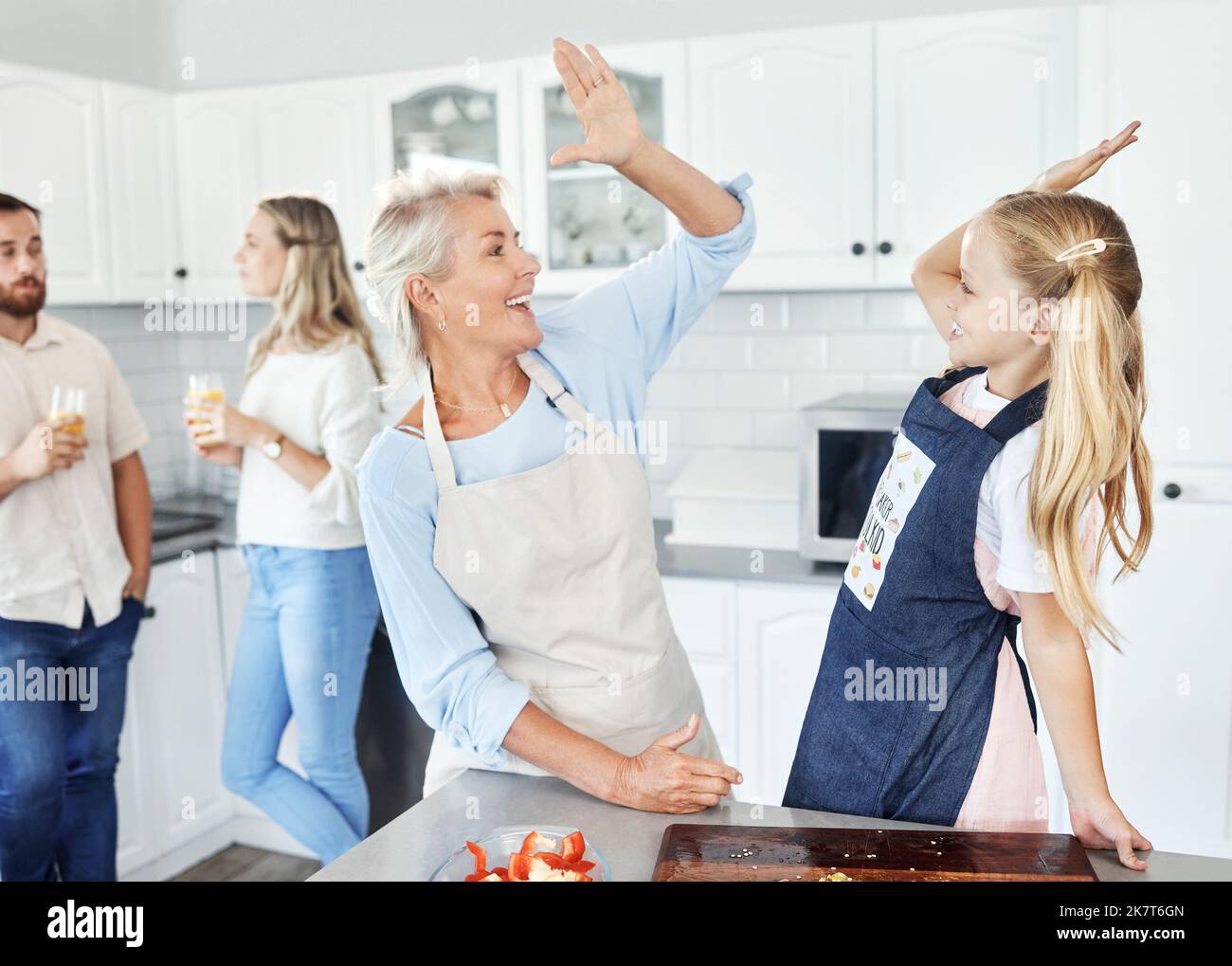 High five, kitchen and cooking family or grandmother and child for ...