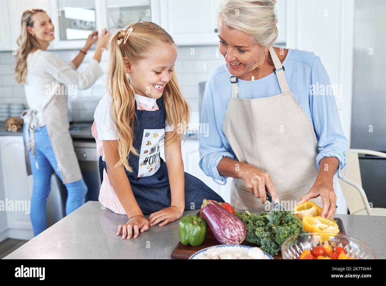 Learning, mother and grandmother cooking with girl teaching her a ...