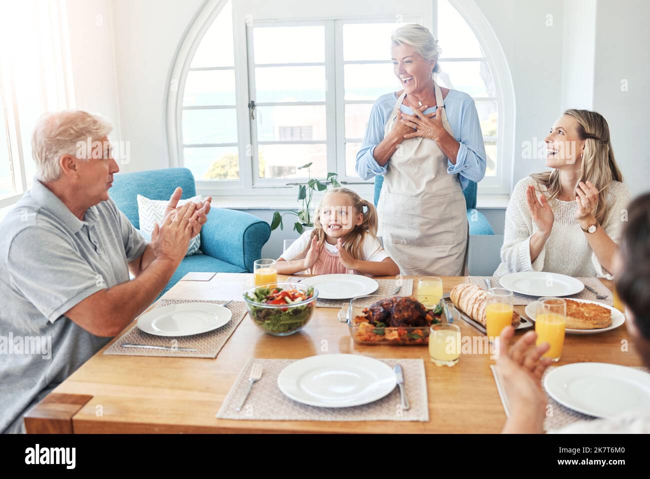 Big family, food celebration and child with parents and grandparents ...