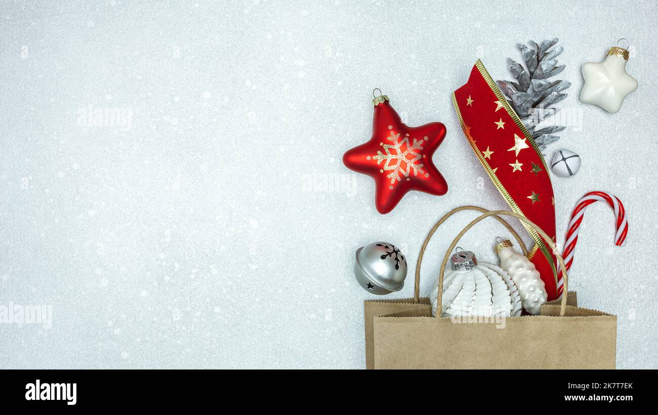 christmas paper bag with gift, toys and decorations on silver ...