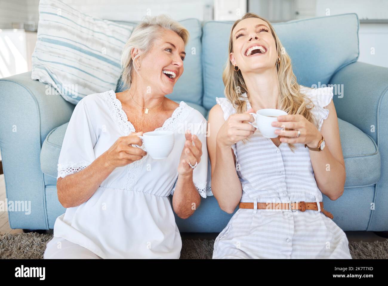 Coffee, mother and daughter with comic communication together on the living room floor of their ...