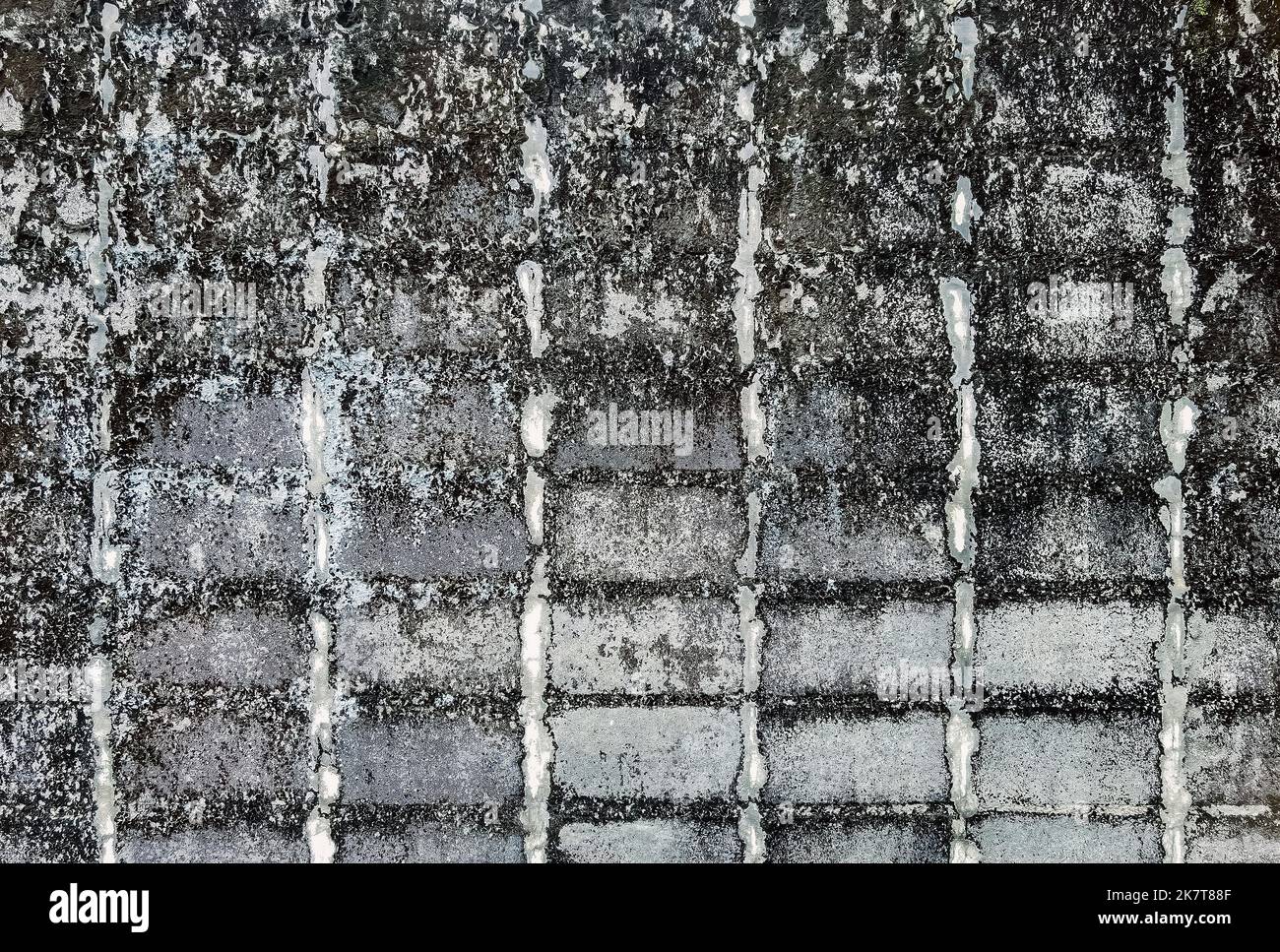 Dirty old eroded cracked plaster cement block fence. Concrete block ...