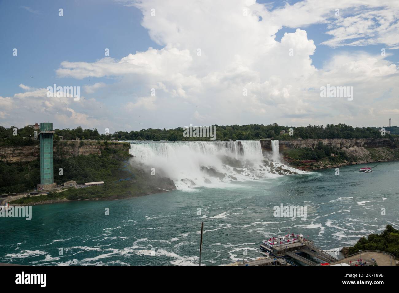 American Falls view from Canada side on cloudy day. Waterfall with blue ...