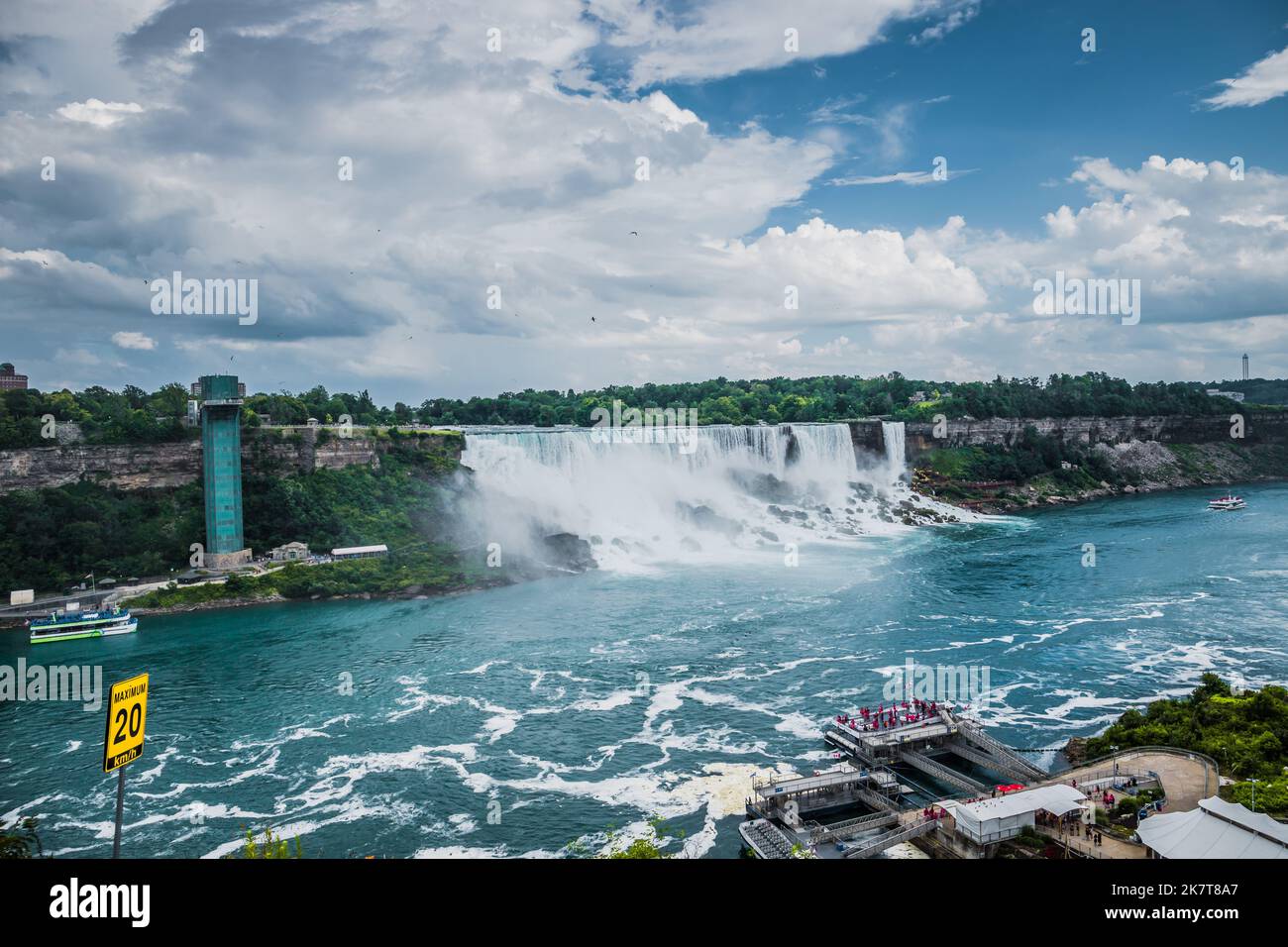 American Falls view from Canada side on cloudy day. Waterfall with blue ...