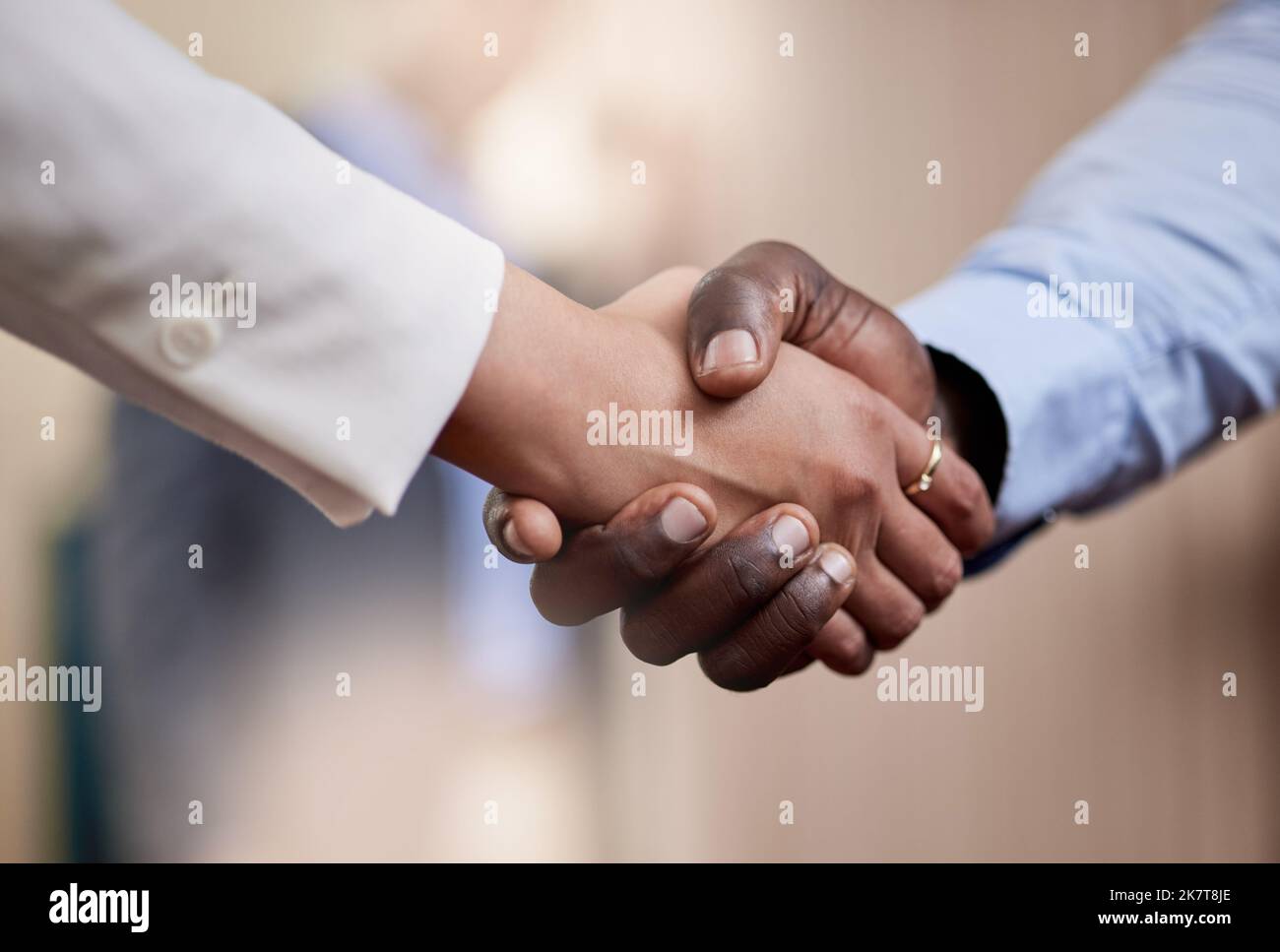 Welcome aboard the ship. two businesspeople shaking hands in greeting ...