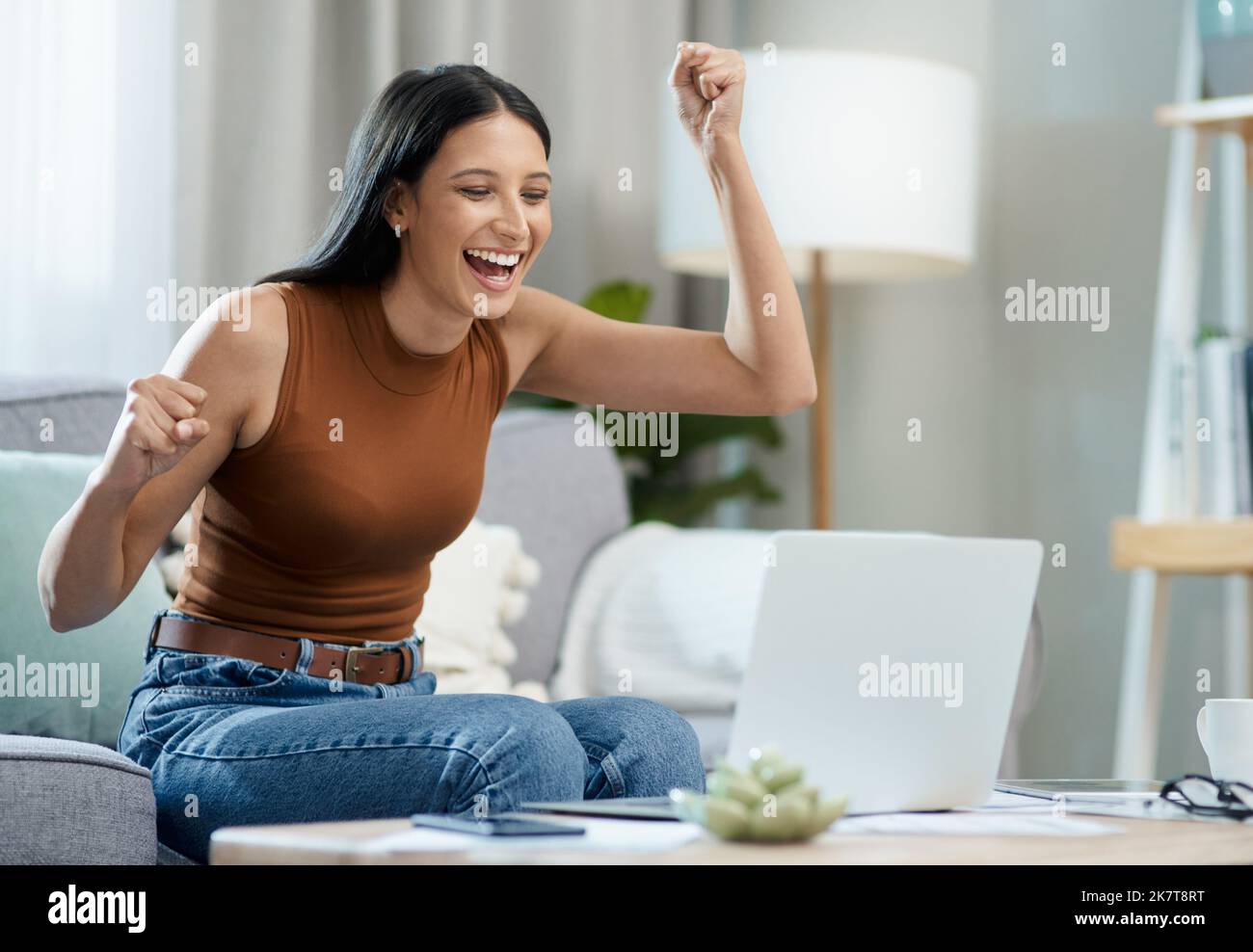 Yes I passed my exams. an attractive young woman sitting alone in her ...
