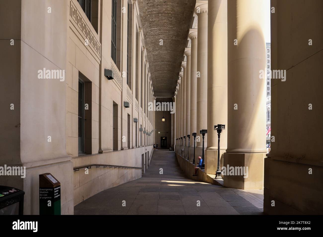 Old restored building - massive columns and a long corridor. Ancient ...