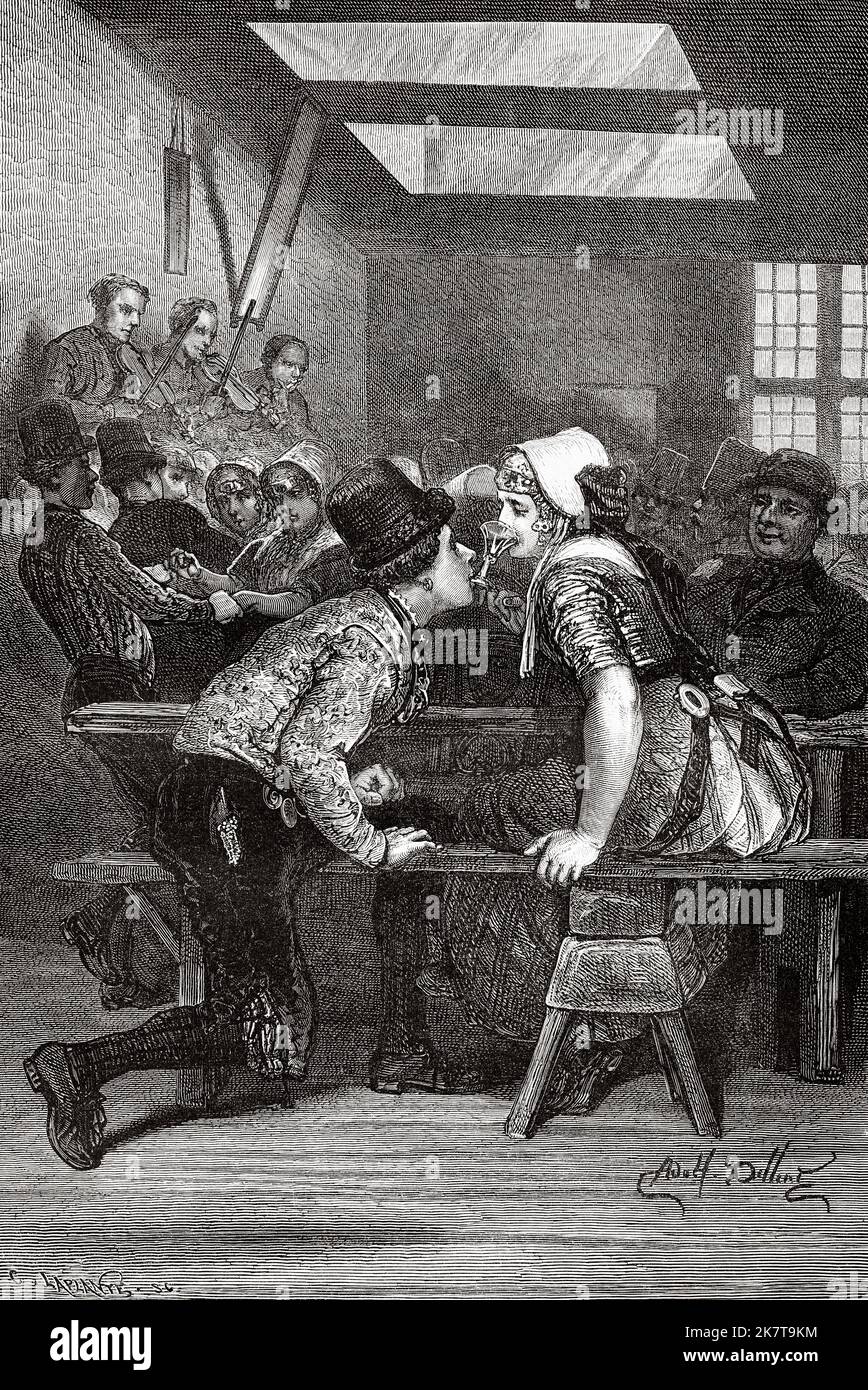 A young man holds a glass in his teeth for his lover to drink from ...