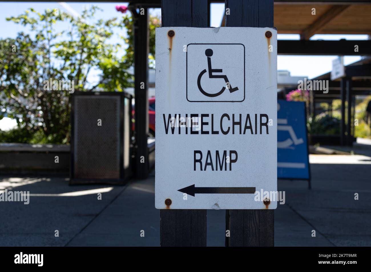 View of directional sign Wheelchair Ramp attached to the fence Stock ...