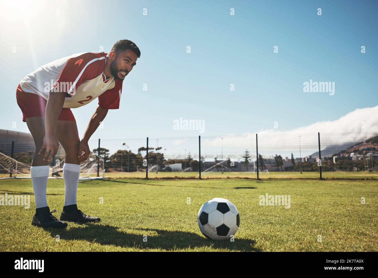 Soccer training, exercise and man at soccer field with ball, getting ...