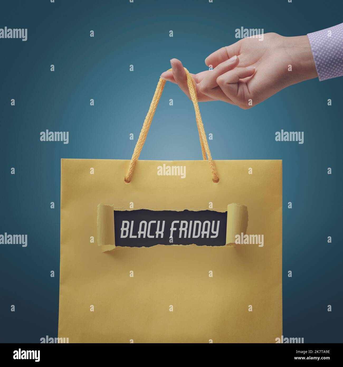 Customer holding a shopping bag, Black Friday promotional sale Stock ...