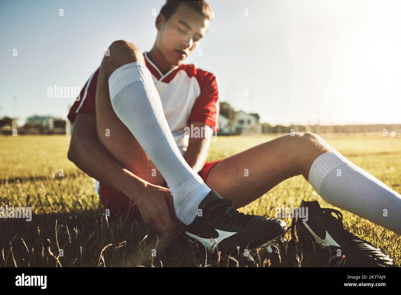 Soccer player tying shoe hi-res stock photography and images - Alamy