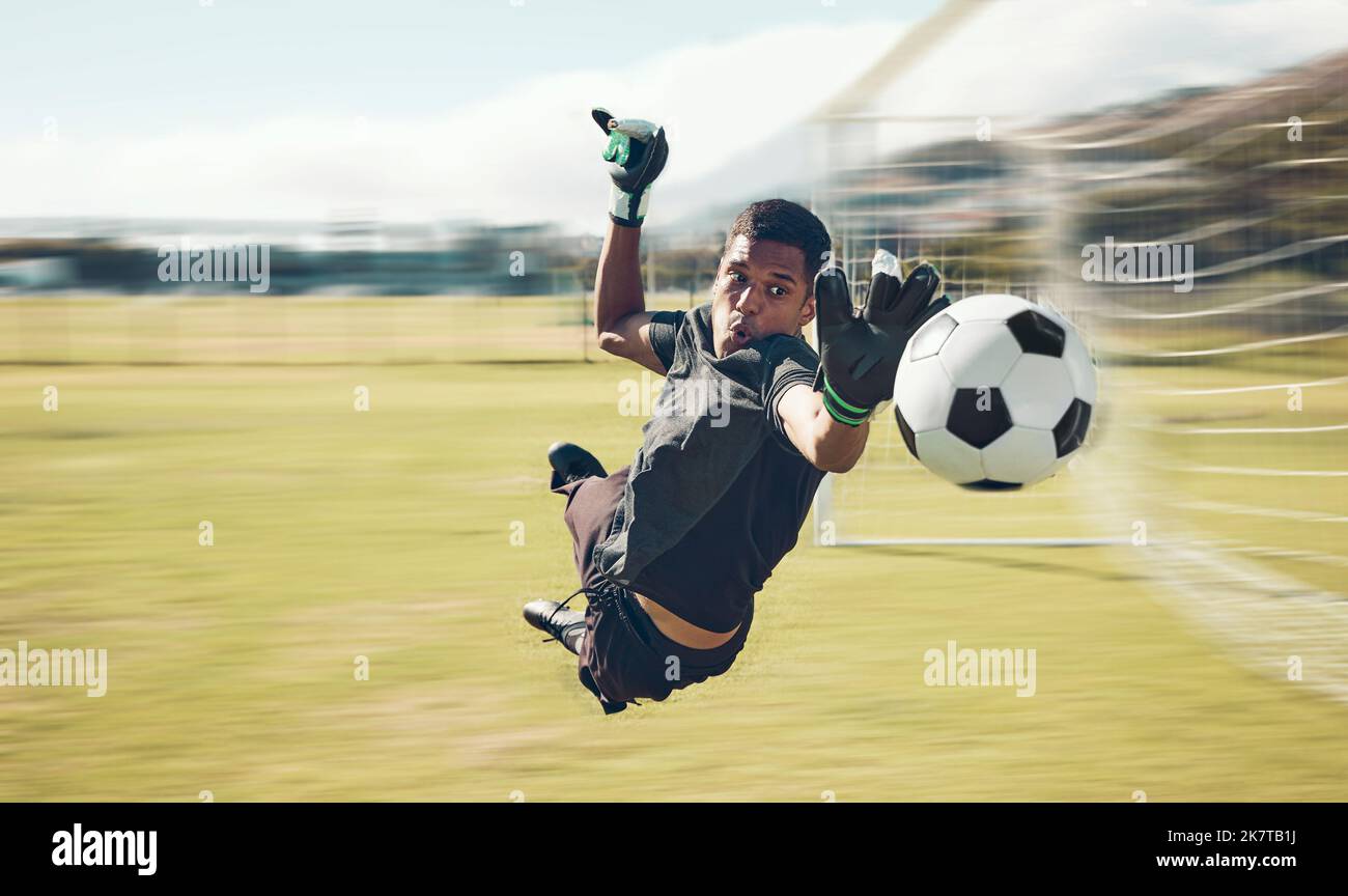 Soccer, sports and goalkeeper with a man saving a shot, goal or score ...