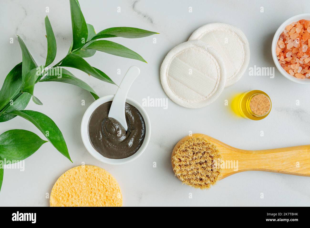Homemade clay mask for the face and body in a white bowl next to ...