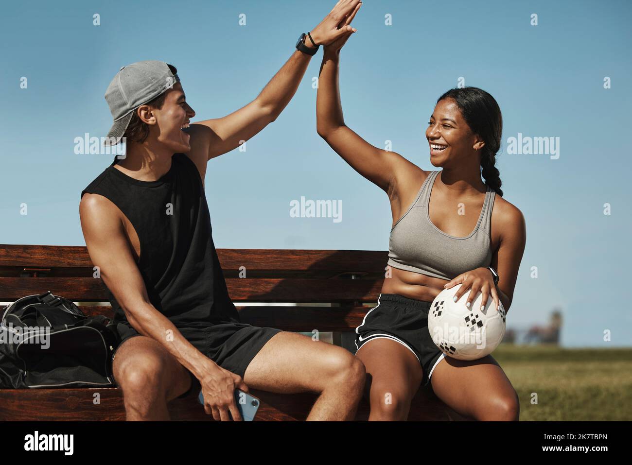 High five, soccer and team celebrate winning match, happy and smile on ...