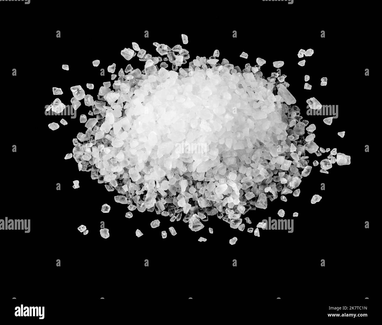 A heap of sea salt on black background Stock Photo - Alamy