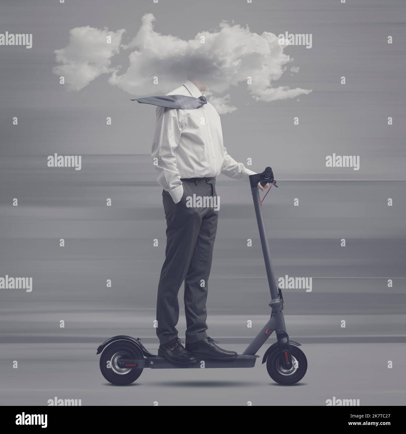 Businessman riding an electric scooter with his head in a cloud ...