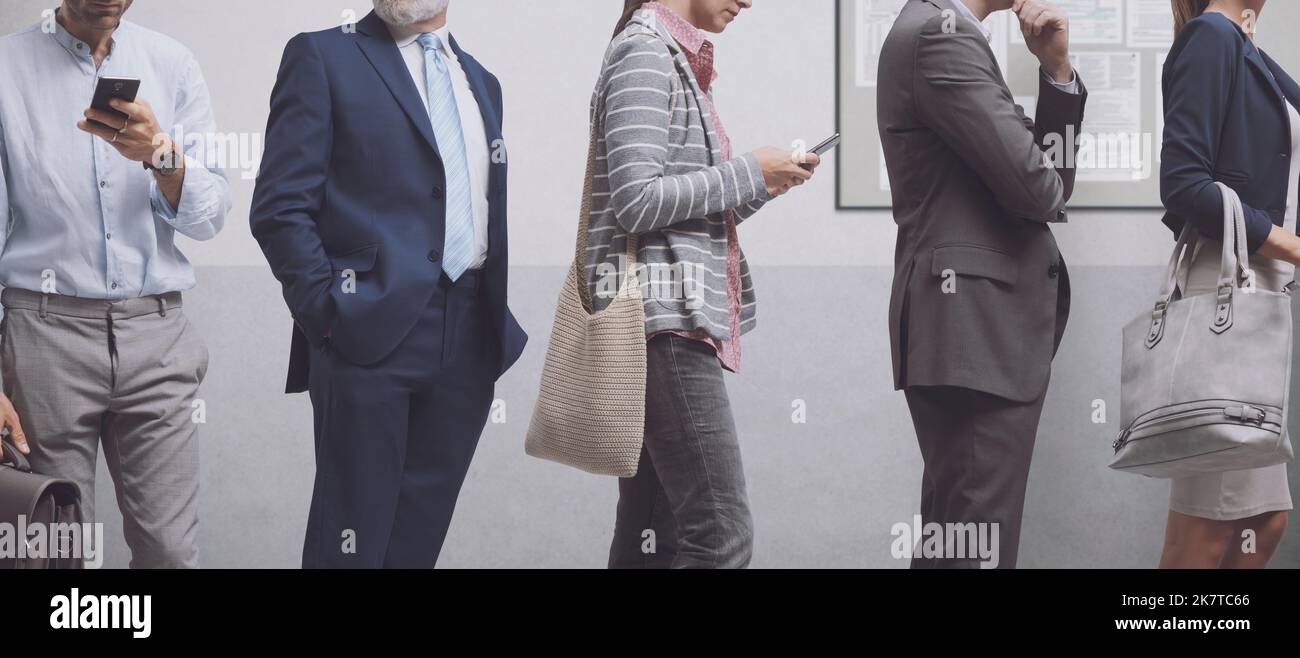 Diverse business people standing and waiting in line, services and ...