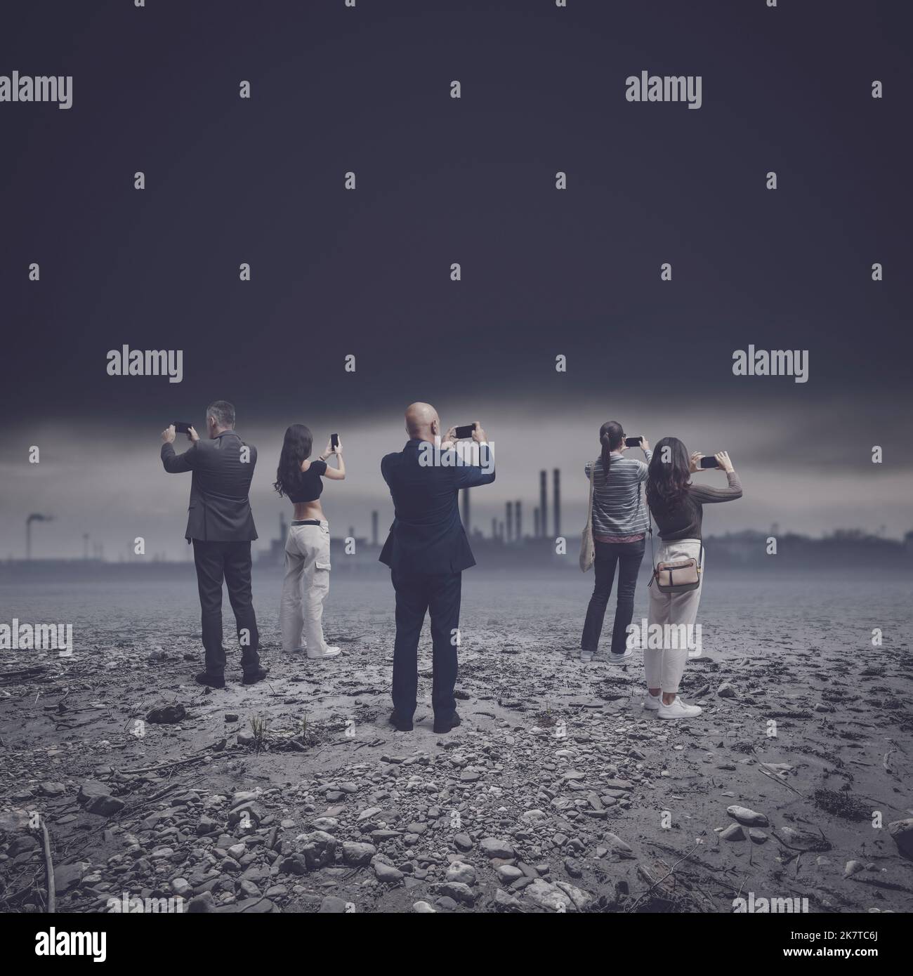Group of people taking pictures of a barren land with polluting ...