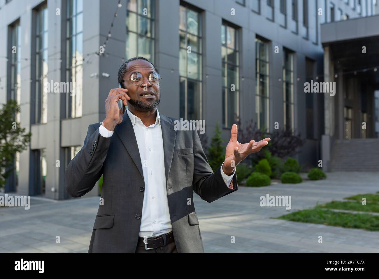 Successful senior businessman talking on mobile phone smiling, african ...