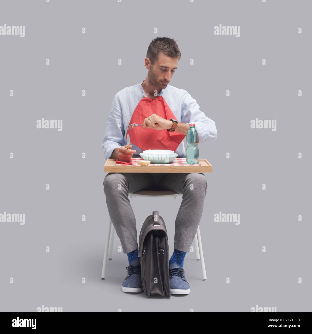 Man sitting on a chair in the waiting room and having lunch break Stock ...