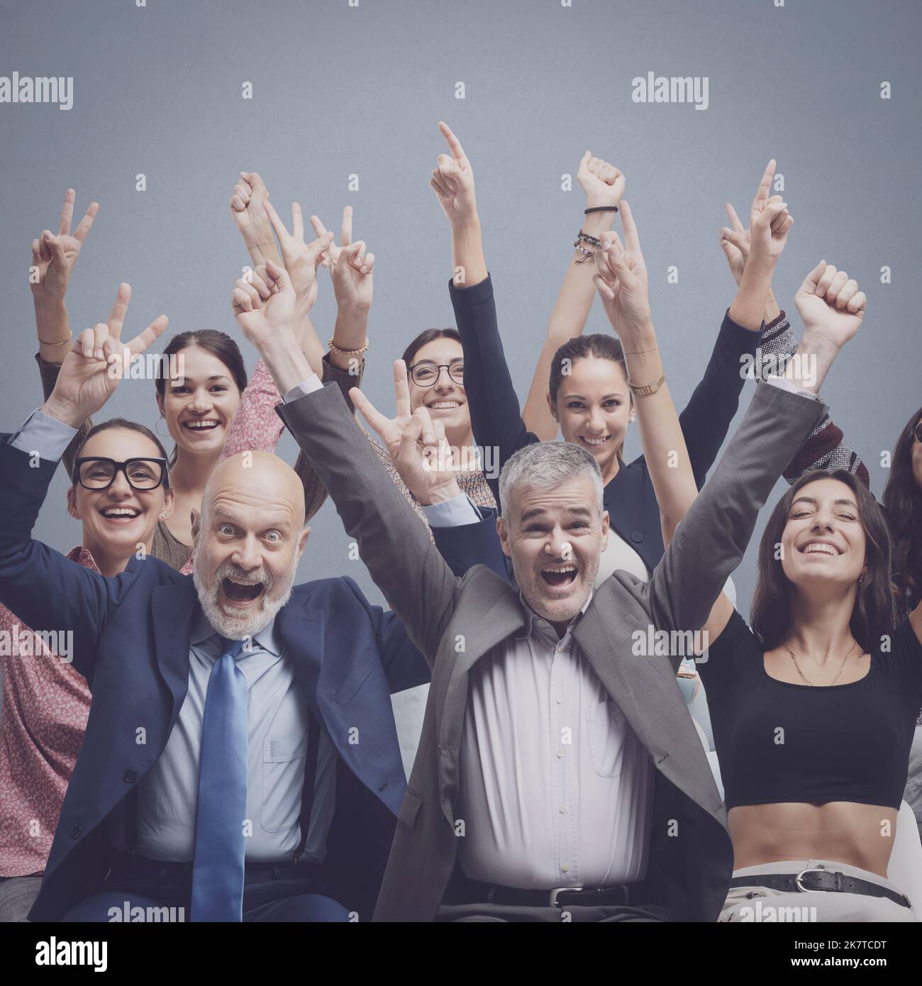 Group of diverse people celebrating together their success, they are ...