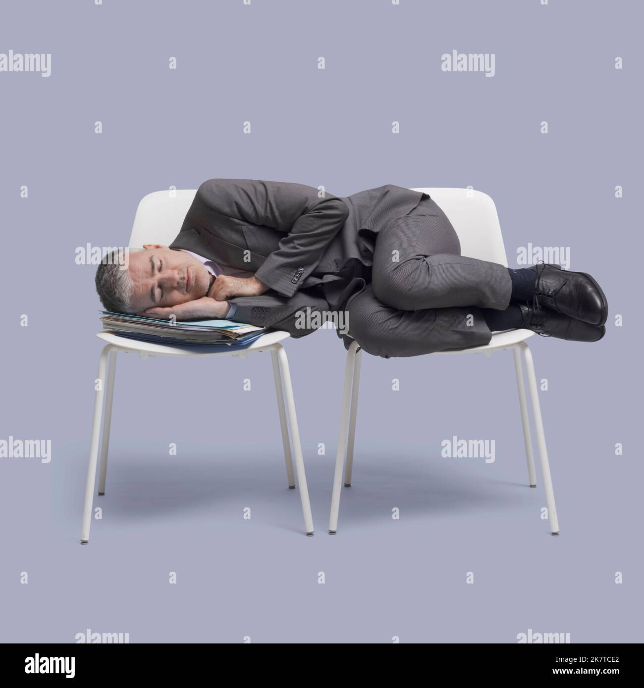 Curled businessman hi-res stock photography and images - Alamy