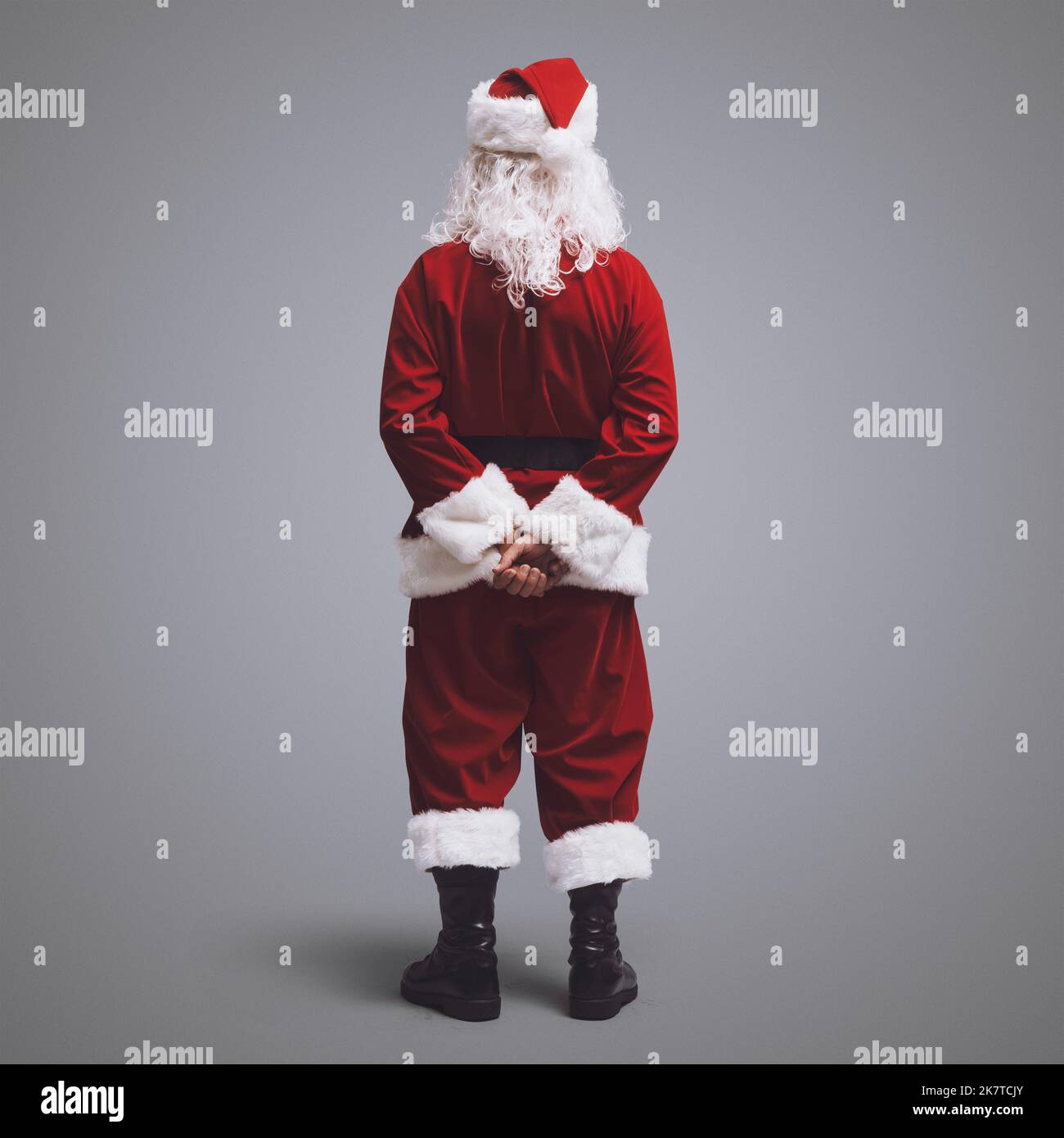 Santa Claus standing and looking away, back view, Christmas and ...