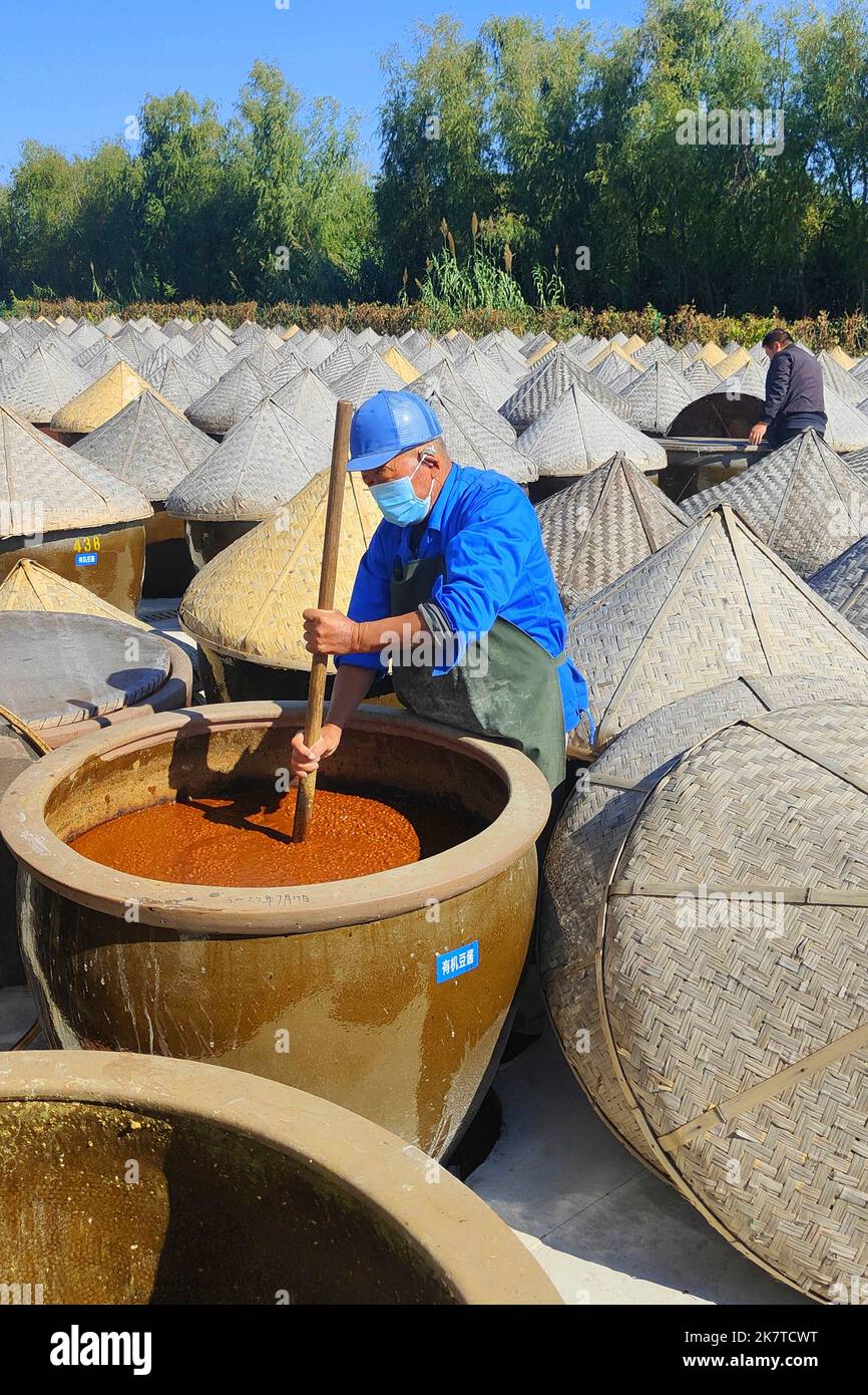 RUGAO, CHINA - OCTOBER 19, 2022 - Photo shows workers stirred the soy ...