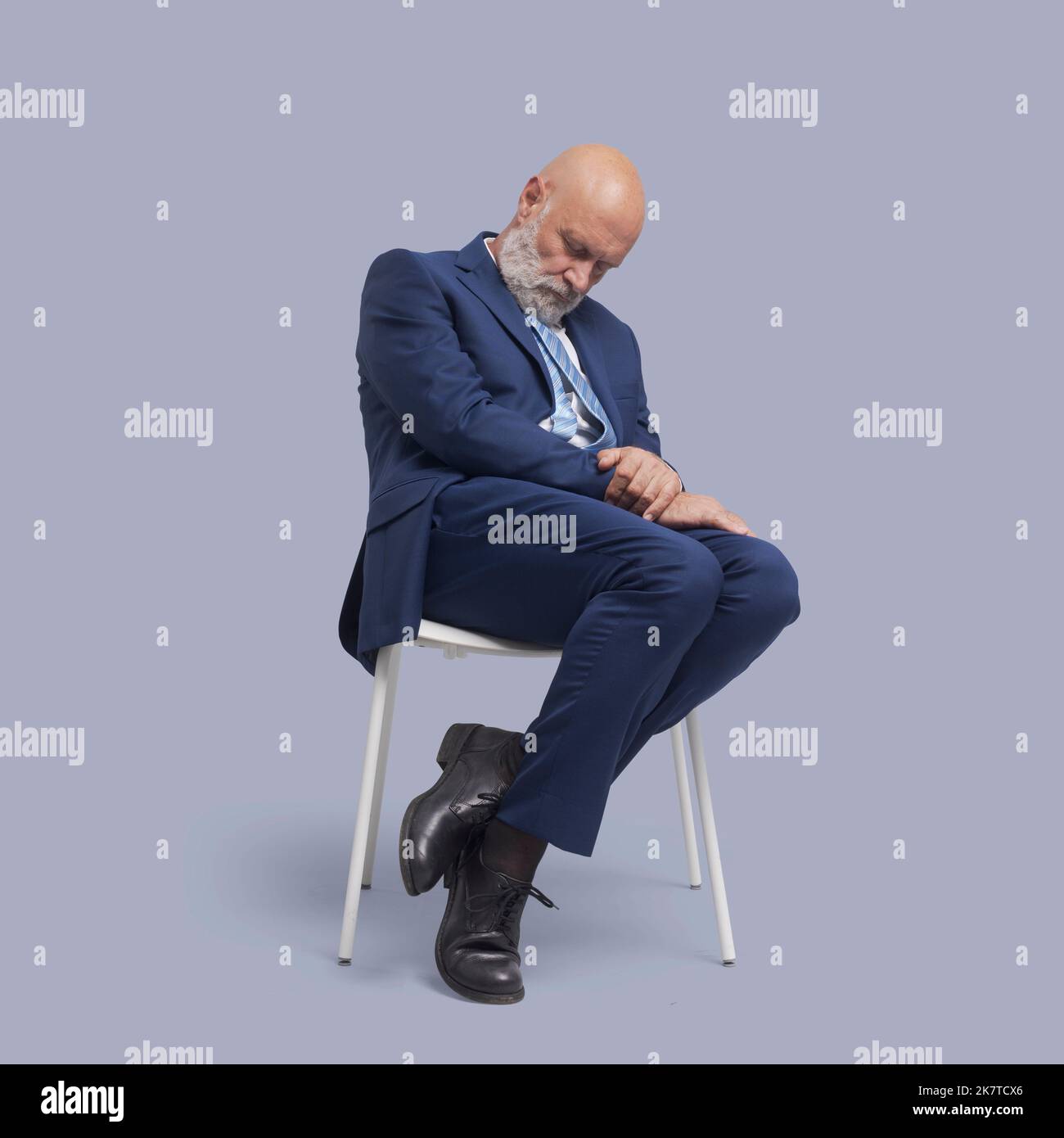 Businessman sleeping on chair hi-res stock photography and images - Alamy