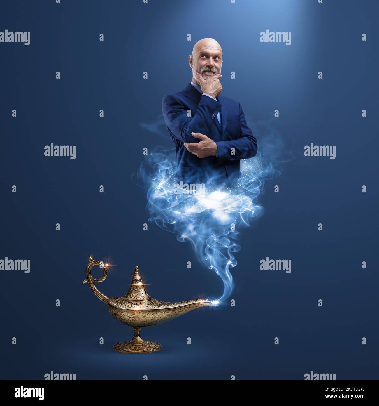 Corporate businessman genie coming out from a magic lamp, he is ...