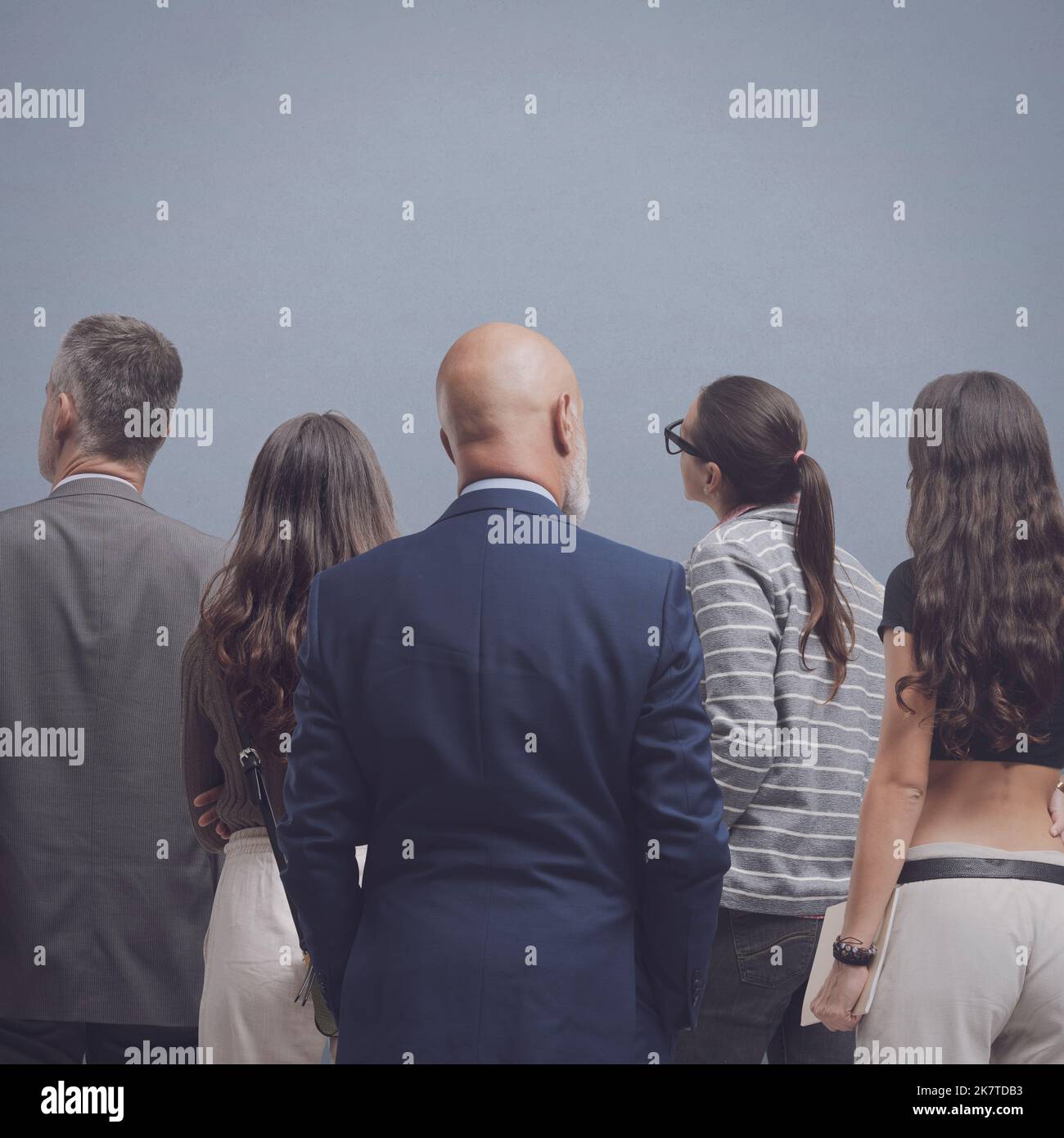 Group of diverse people standing and looking forward, back view Stock ...