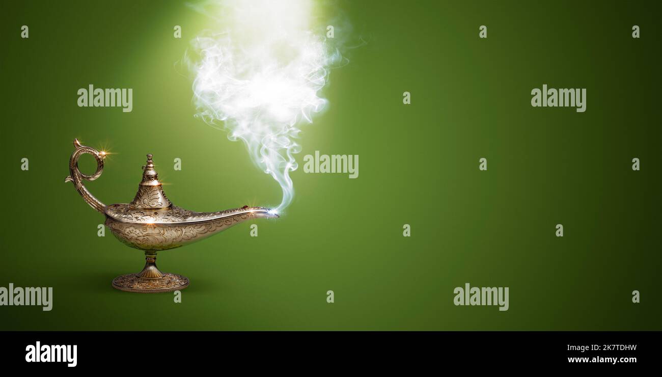 Precious golden magic lamp with smoke on green background, fairy tales ...