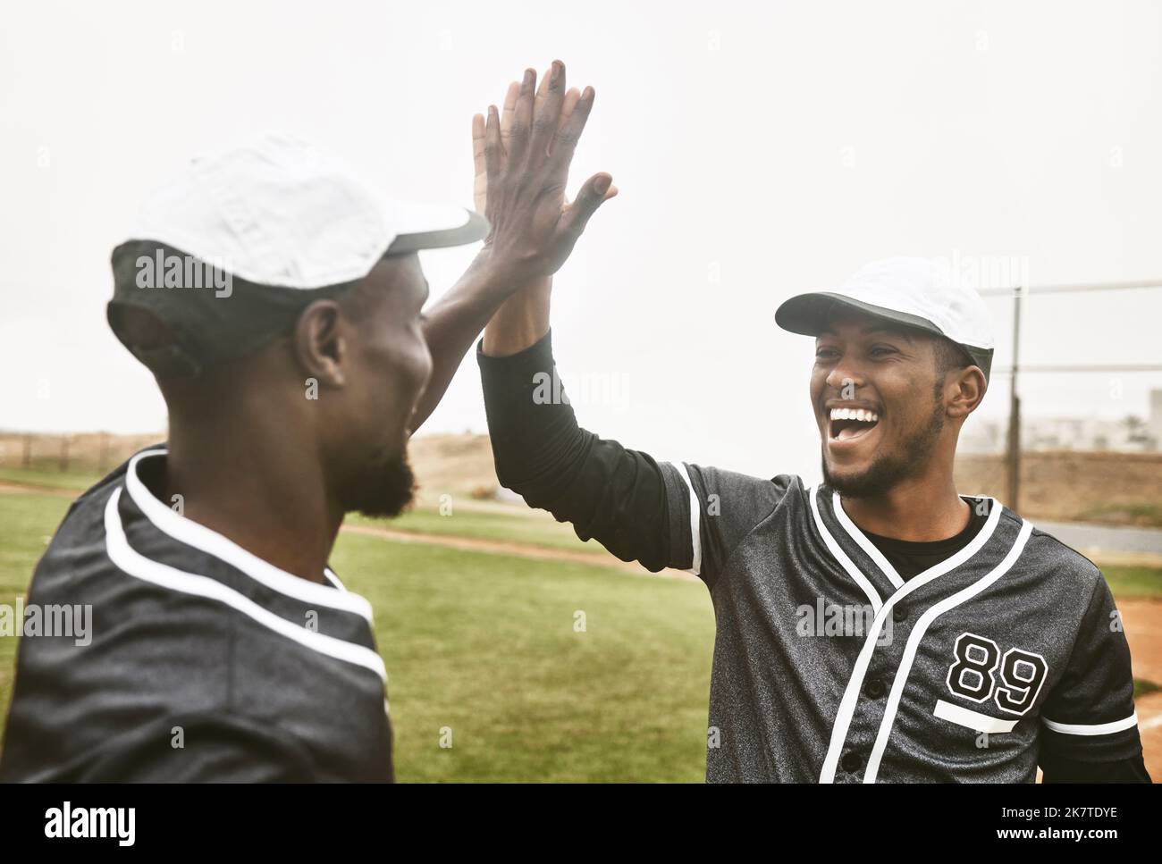 Baseball, high five or teamwork with black men training, workout and ...
