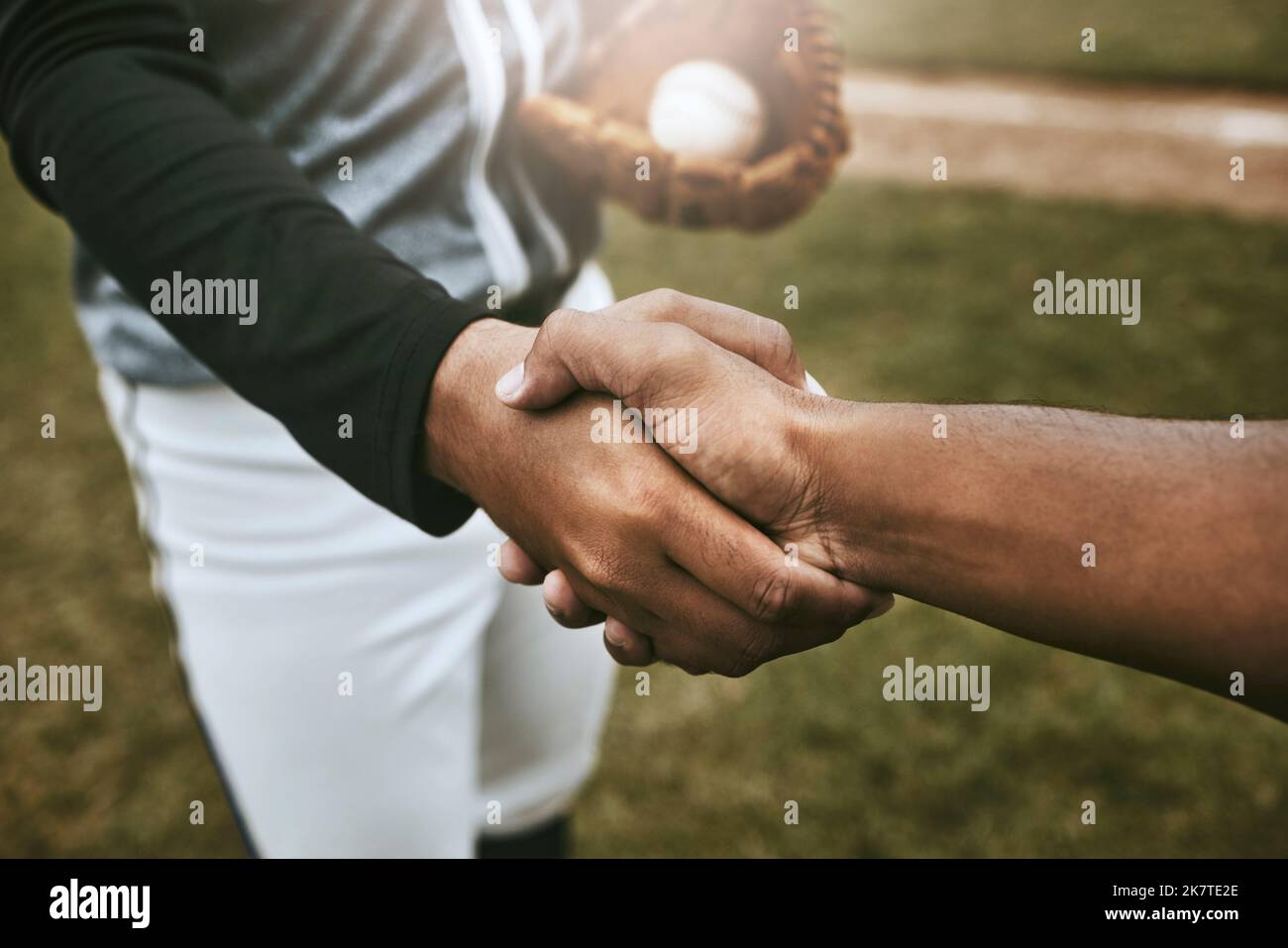Baseball players handshake before game at baseball field for good luck ...