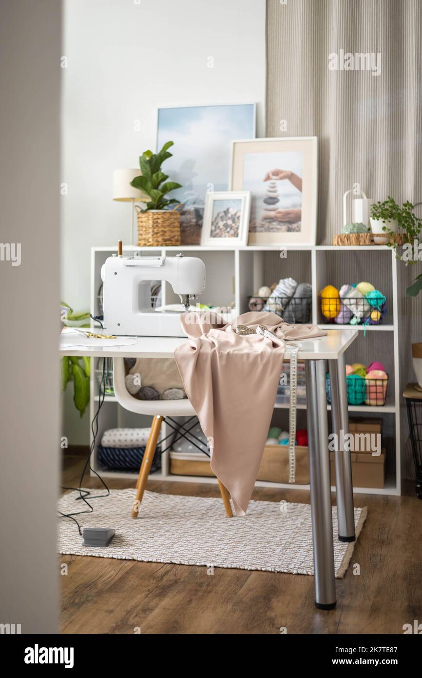 Modern workplace of tailor textile craft designer table with sewing ...